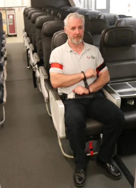 New restraint system addresses airline passenger violence - Runway ...