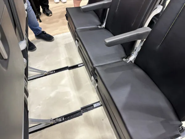 Flip-up exit mini-seat enables density, but at what cost?Runway Girl